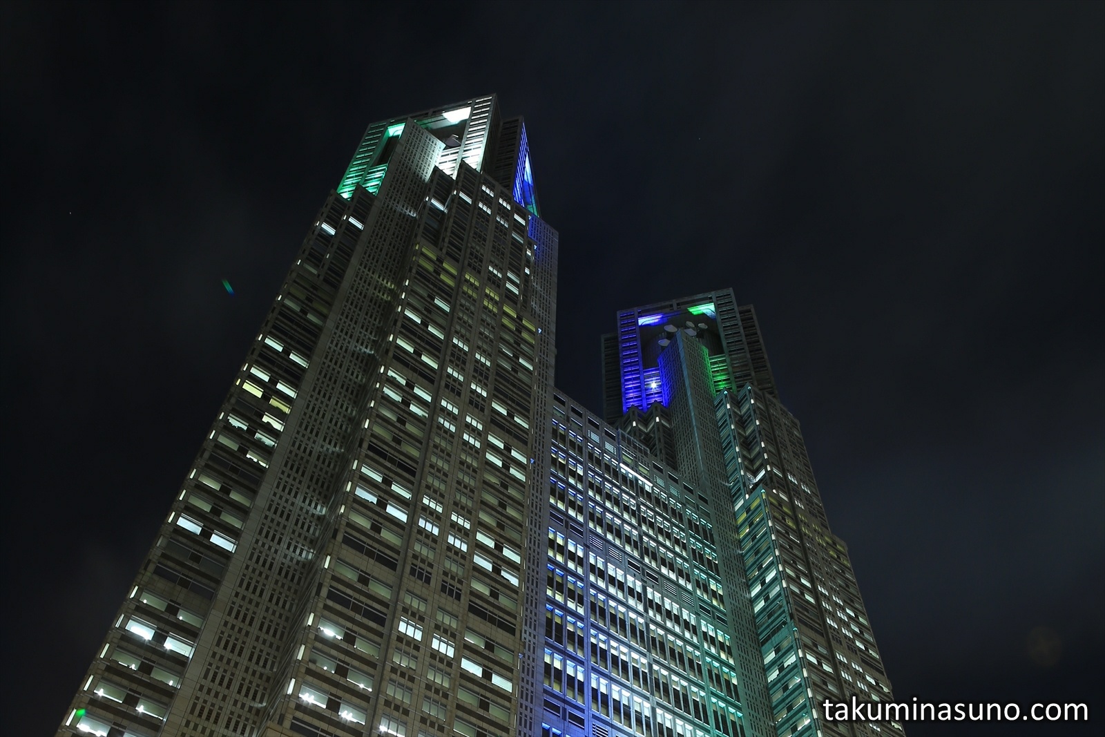 Looking Up to Tokyo Metropolitan Tower in Blue, White and Green - 10 ...